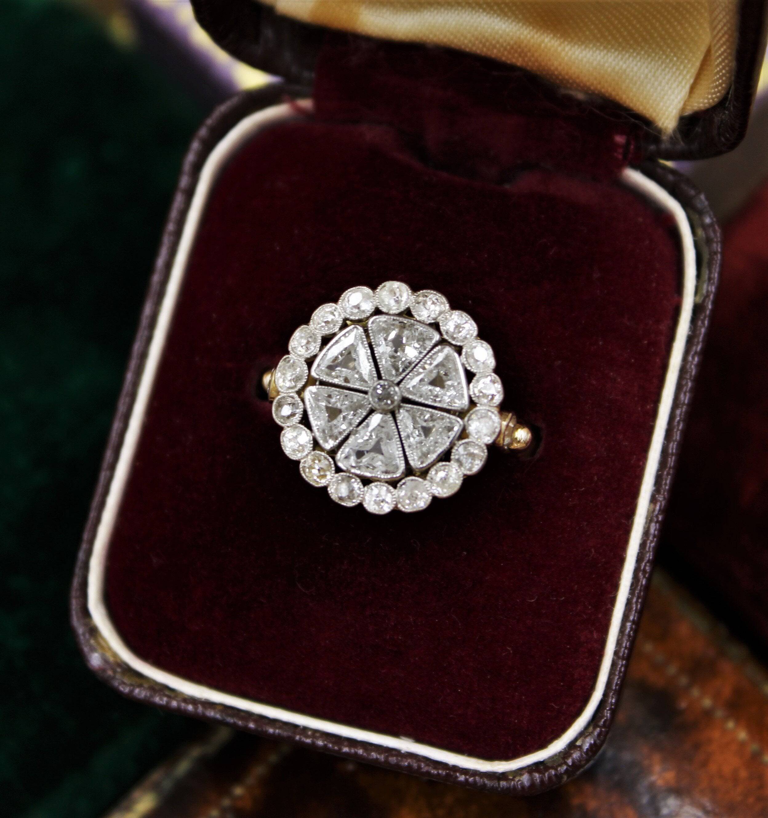 An exceptionally fine Triangular-Cut Diamond Cluster Ring set in 18ct ...